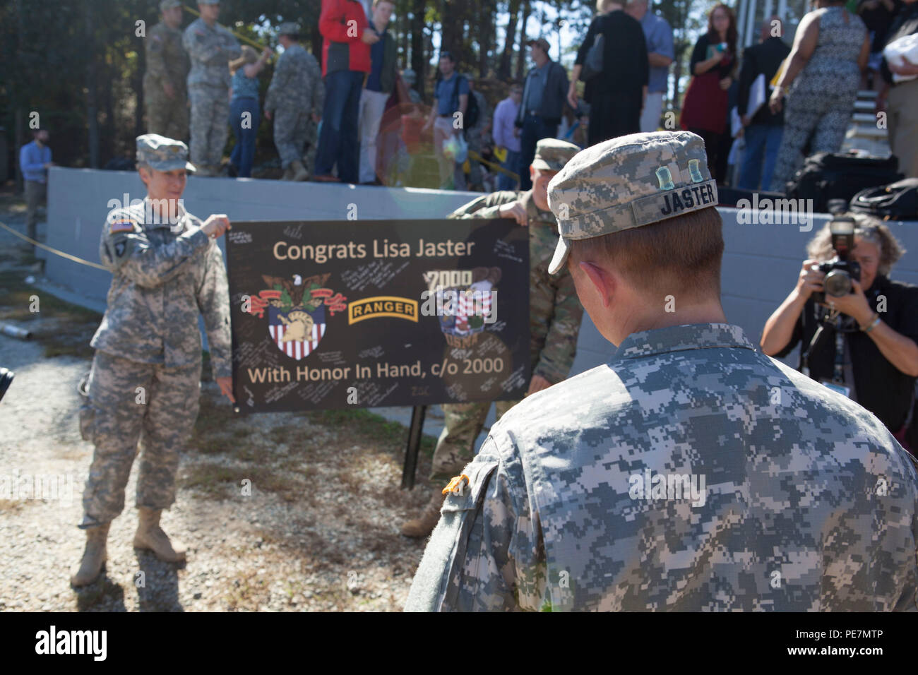 U.S. Army Reserve Maj. Lisa Jaster, right, becomes the third woman to ...