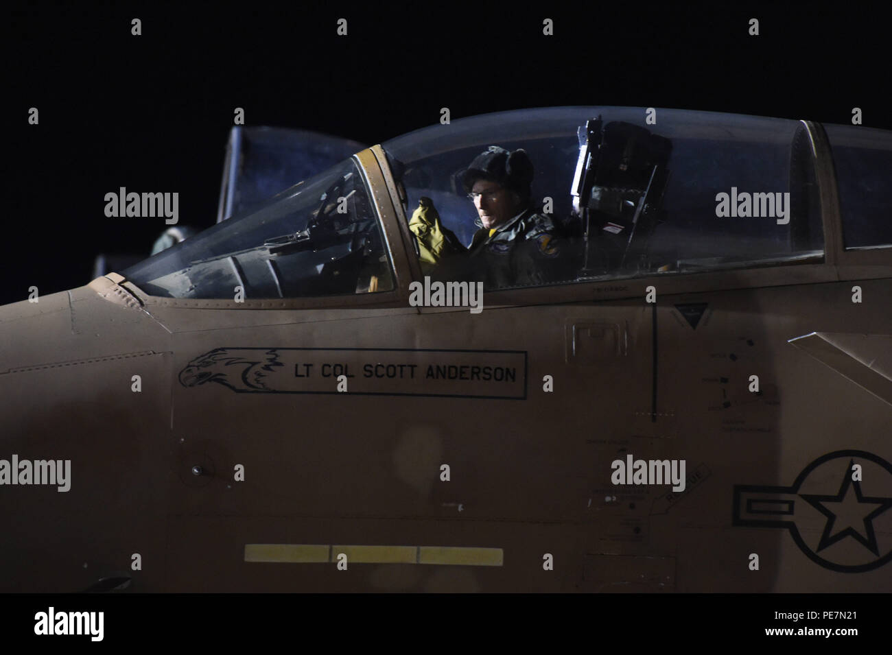 U.S. Air Force Lt. Col. Scott Anderson, pilot, prepares to exit the U.S ...