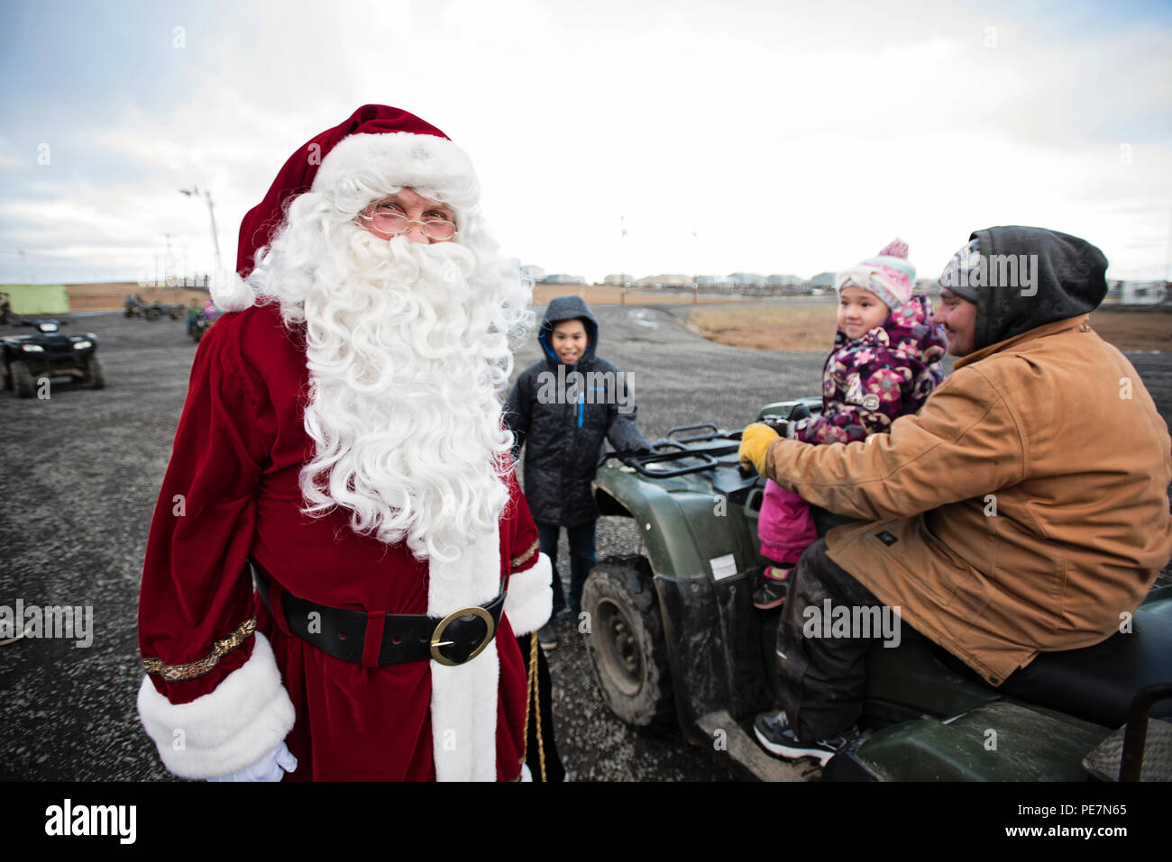 Santa Claus smiles after after being greeted by townspeople in Savoonga ...