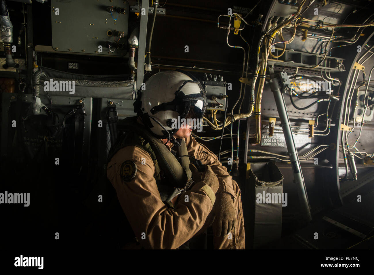 Gunnery Sgt. Kevin P. Levasseur communicates with the pilots of an MV ...