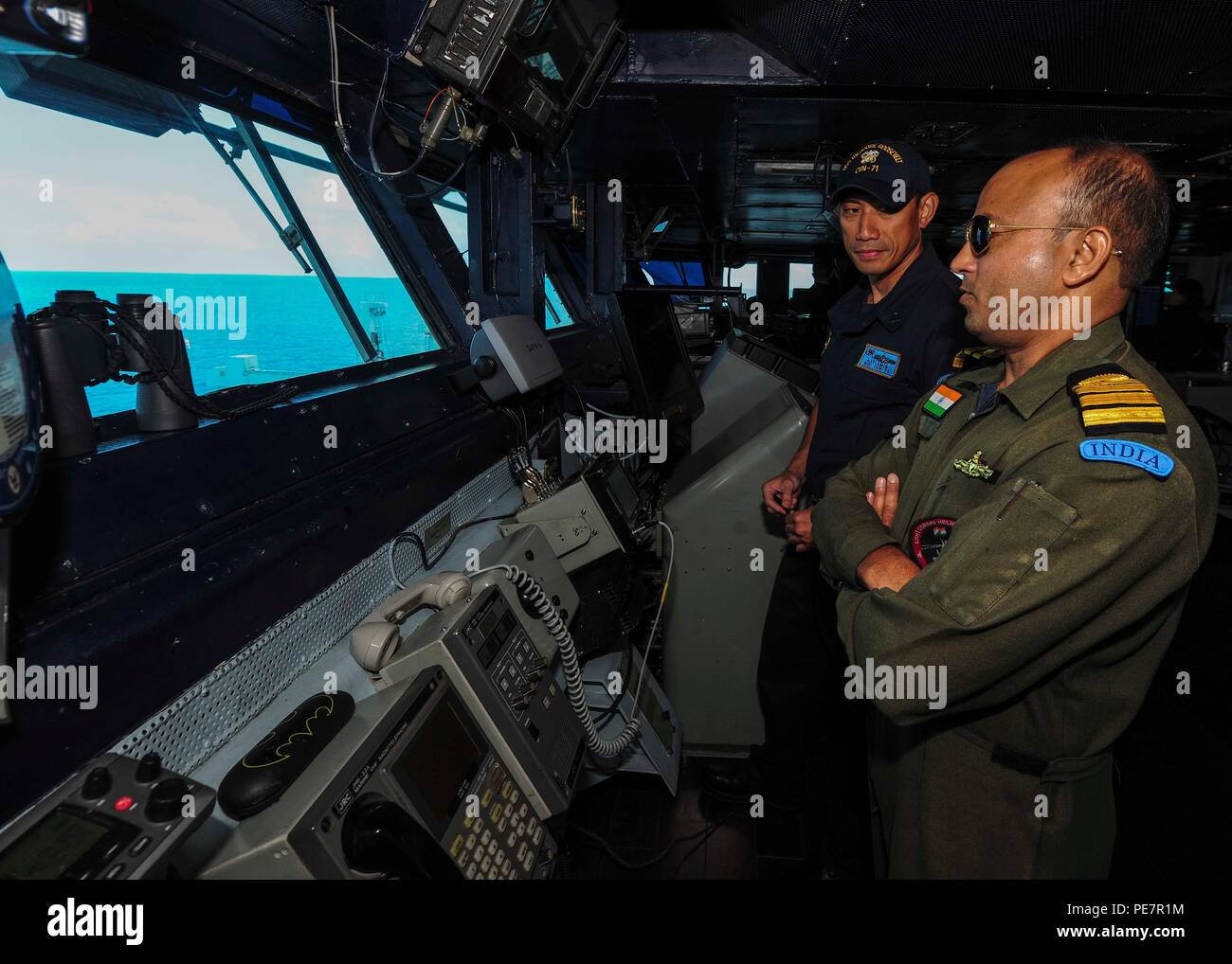 151018-N-PG340-074 INDIAN OCEAN (Oct. 18, 2015) – Lt. Alex Lamis (left ...