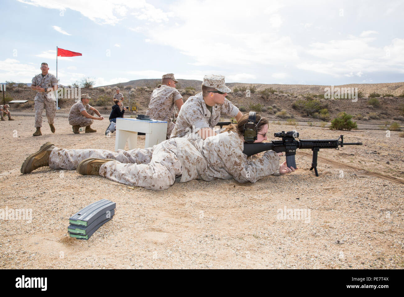 Sarah Kirk and Sgt. William Kirk practice firing from the prone ...