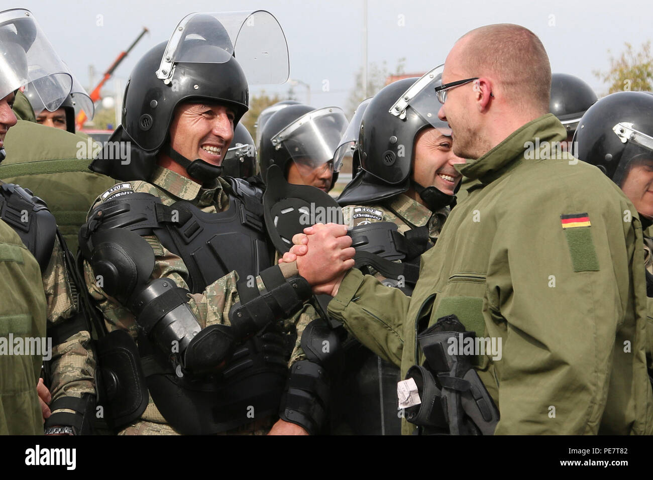 A Turkish soldier (left) shakes hands with a German Soldier after the ...