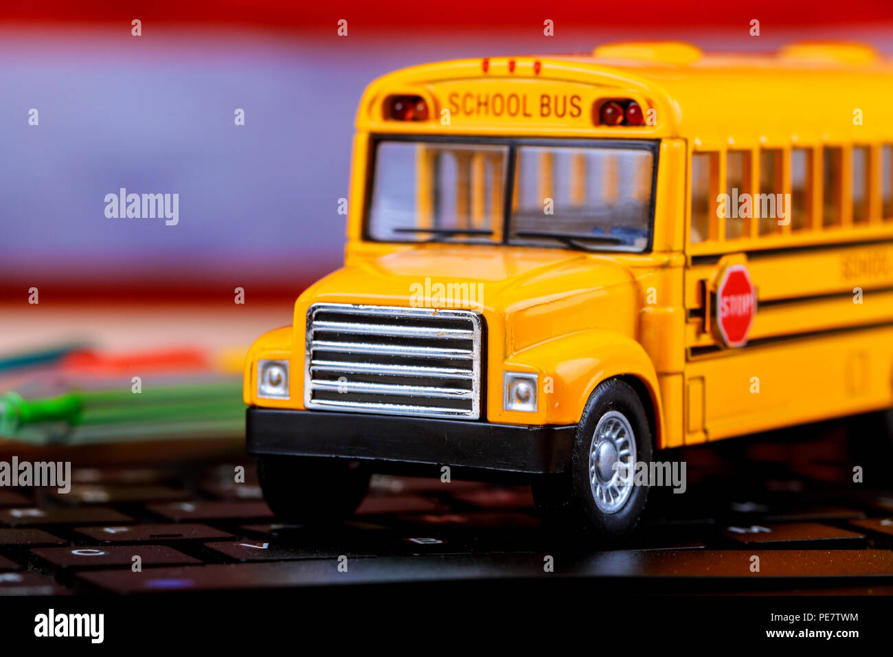 Yellow school bus coming out of a computer screen illustrating online ...