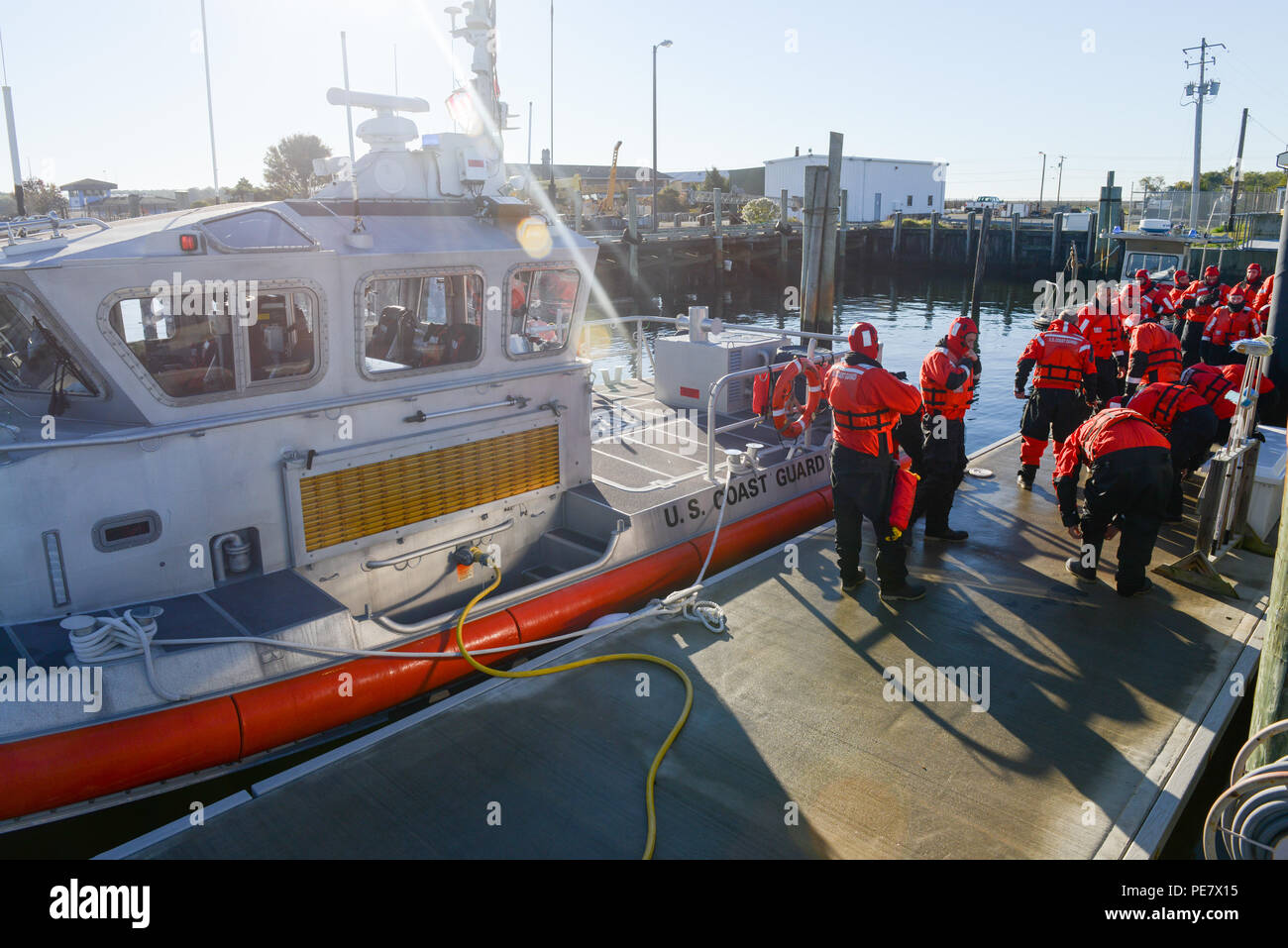 Crew members from the Coast Guard Station, and Aids to Navigation Team ...