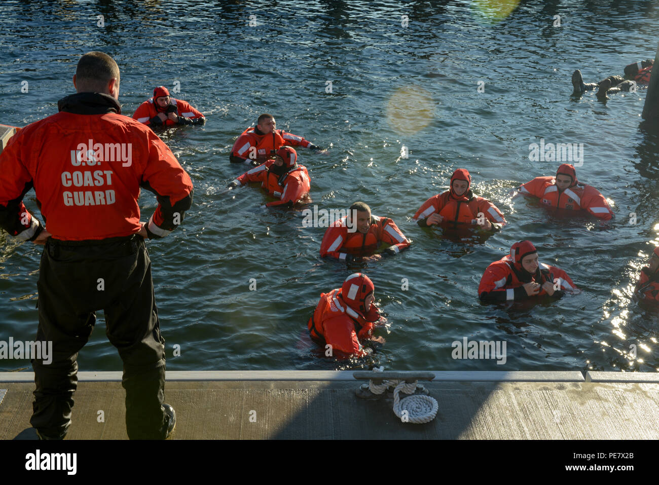 Crew members from the Coast Guard Station, and Aids to Navigation Team ...