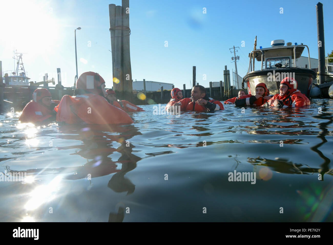 Crew members from the Coast Guard Station and Aids to Navigation Team ...