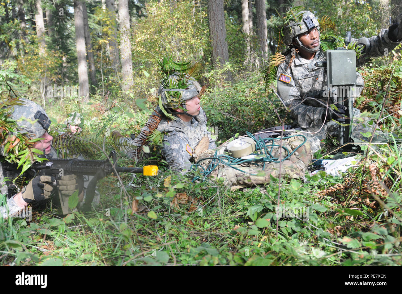 Spc. Casey Payne, left, a Soldier assigned to the 201st Expeditionary ...