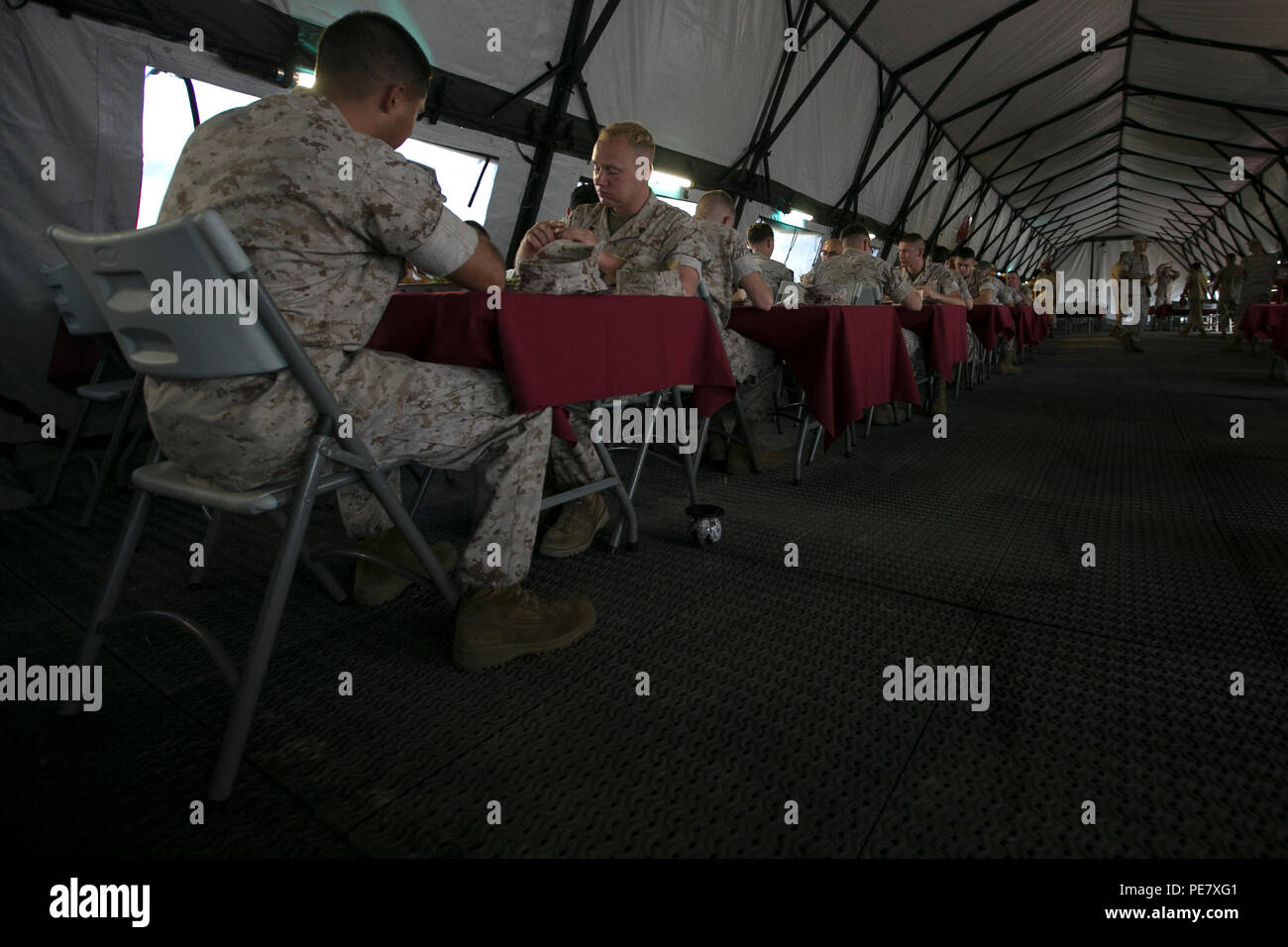 Marines enjoy a meal cooked for evaluation in the field mess category ...