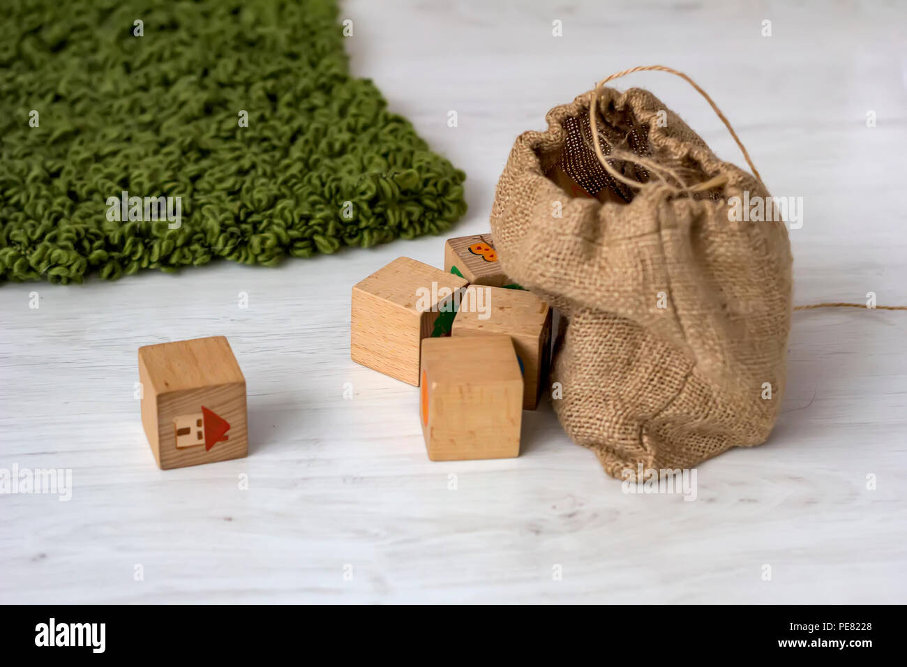 wood cube building blocks and bag on the floor in a home Stock Photo ...