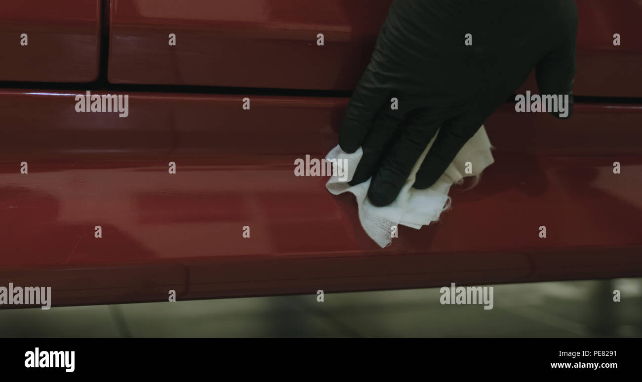 closeup of car paint degreasing with alcohol before polishing, wide ...