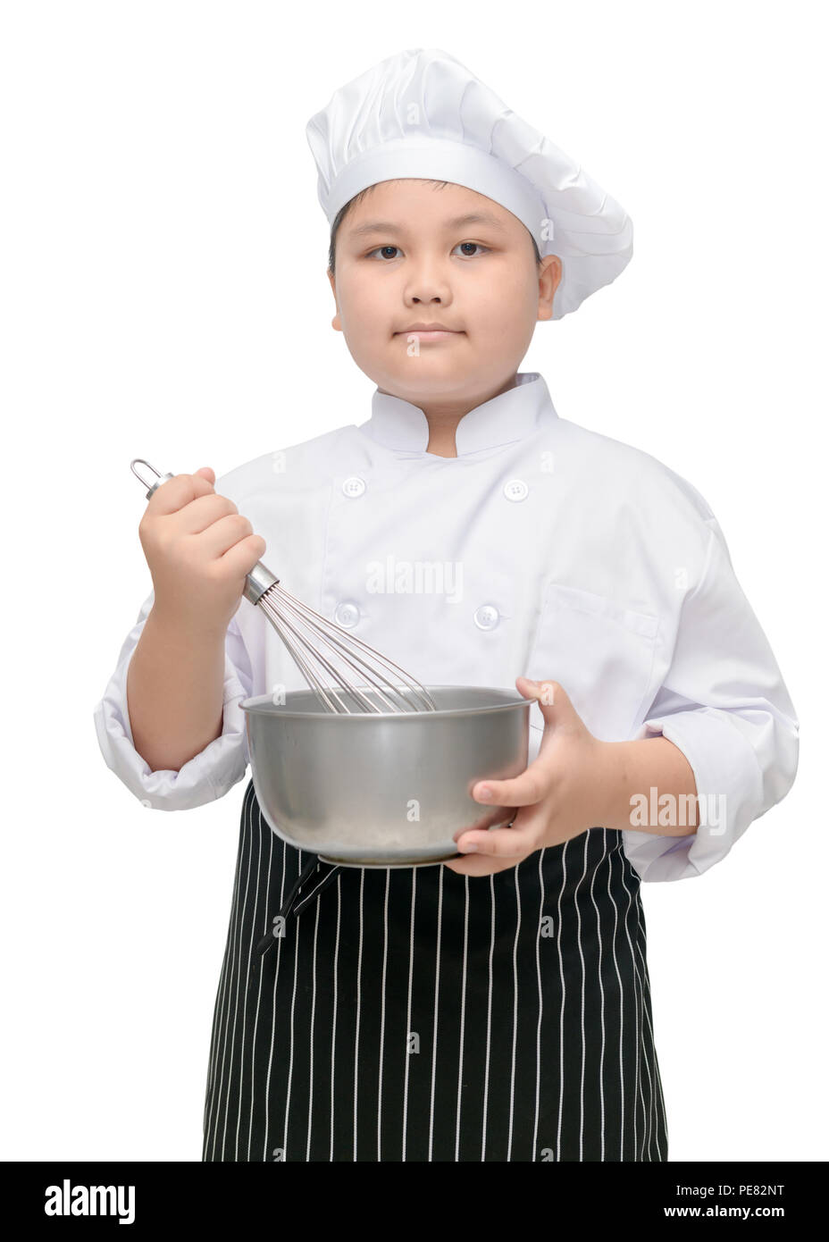 Portrait of cute boy chef hold whisk with cook hat and apron stand and ...