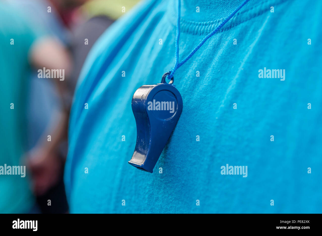 Blue whistle hanging on Stock Photo - Alamy