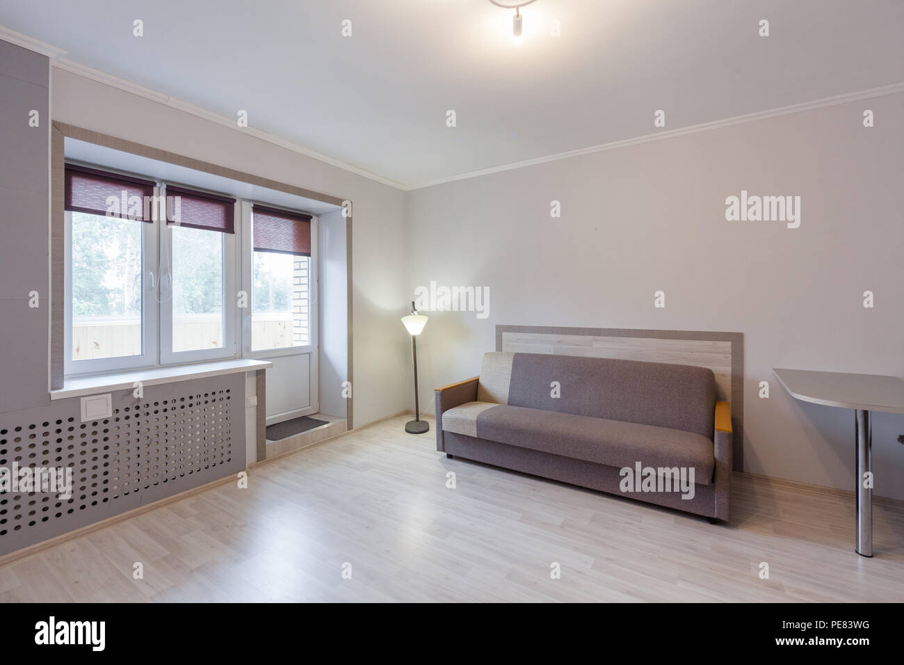Small and light studio apartment interior Stock Photo - Alamy