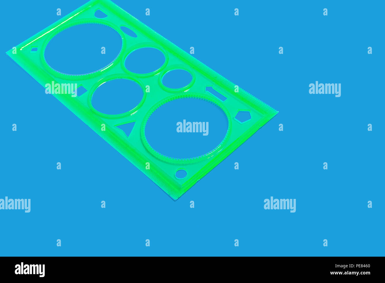 green ruler isolated on the blue surface Stock Photo - Alamy