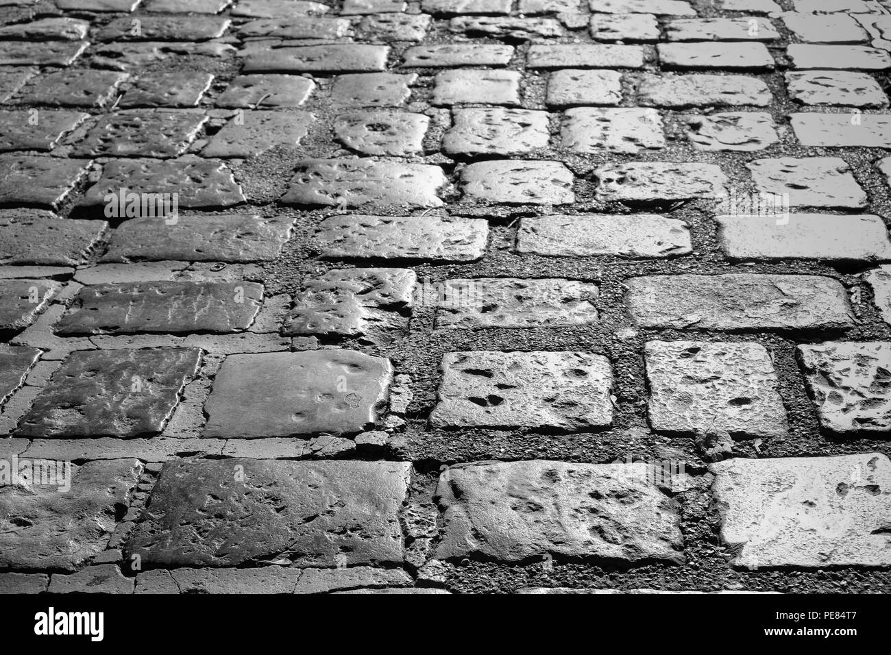 Close up of old cobble stone road surface background texture Stock ...