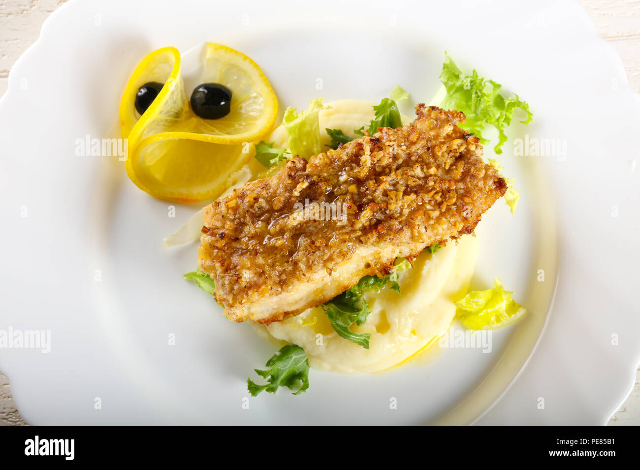 Baked Cod fish with mashed potato Stock Photo - Alamy