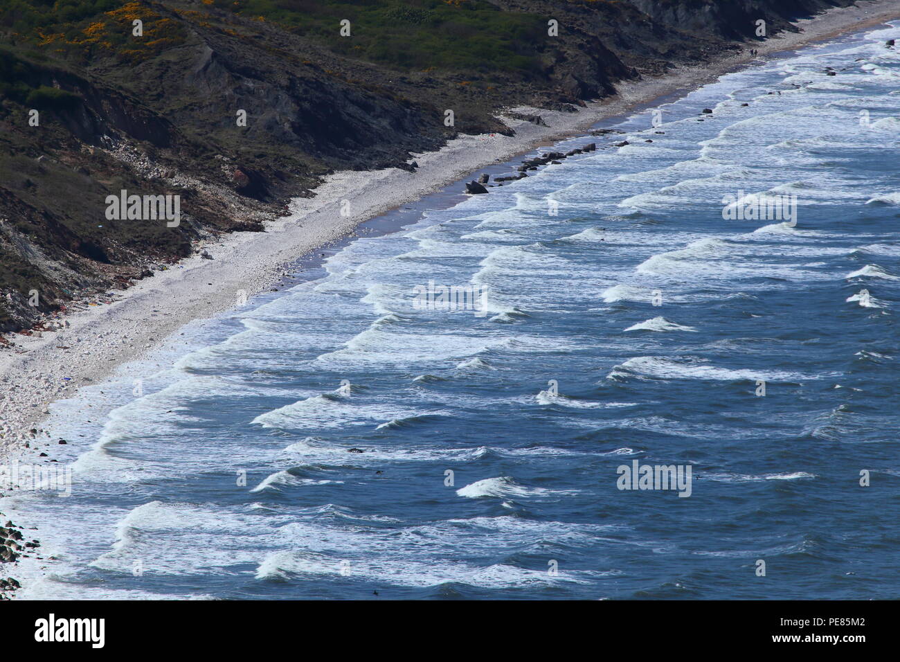 Rough sea at Cayton Bay beach in North Yorkshire Stock Photo - Alamy