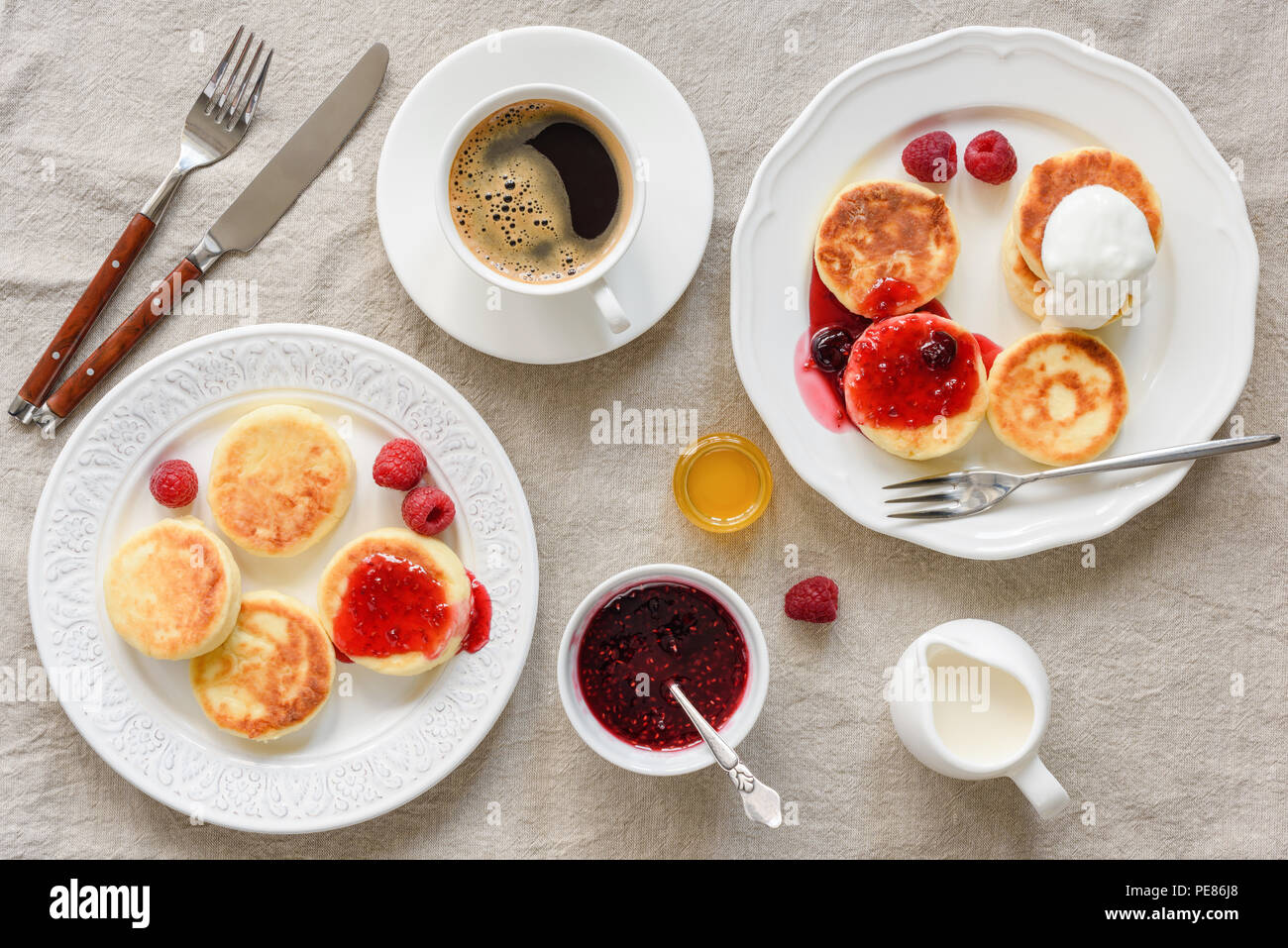 Breakfast table with pancakes and coffee. Cottage cheese pancakes with ...