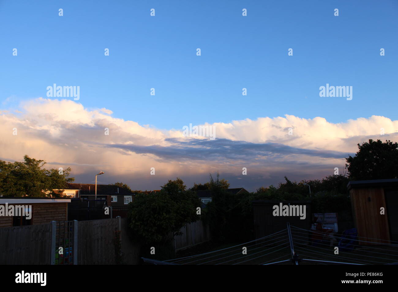 Post storm clouds over Essex town Stock Photo - Alamy