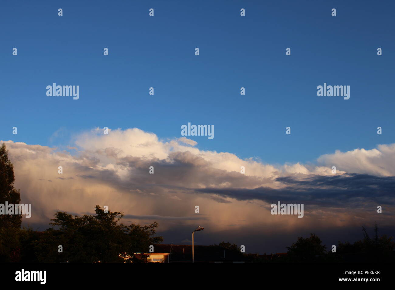 Post storm clouds over Essex town Stock Photo - Alamy