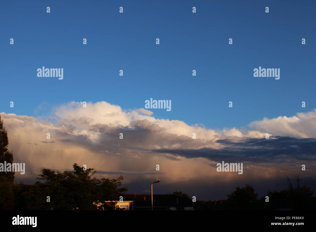 Post storm clouds over Essex town Stock Photo - Alamy