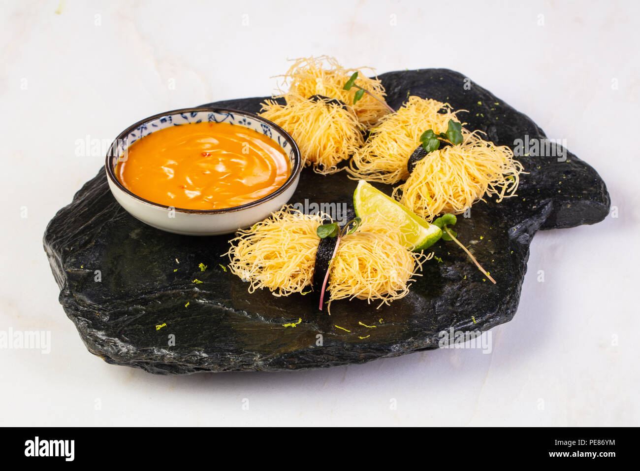 Shrimp in kataifi with mango sauce Stock Photo - Alamy