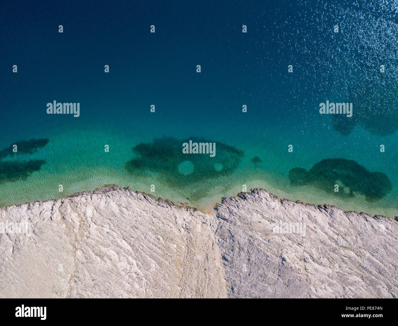 Aerial view of rocks on the sea. Overview of the seabed seen from above ...