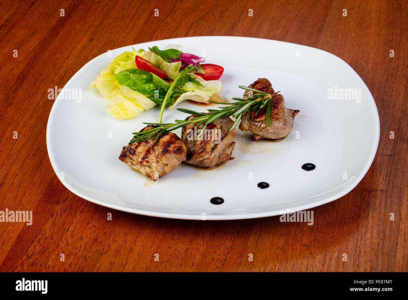 Delicious beef medallions with salad Stock Photo - Alamy