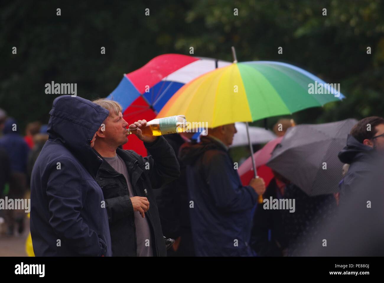 British Public Adorned with Umbrella's and Rain Coats at Bristol ...