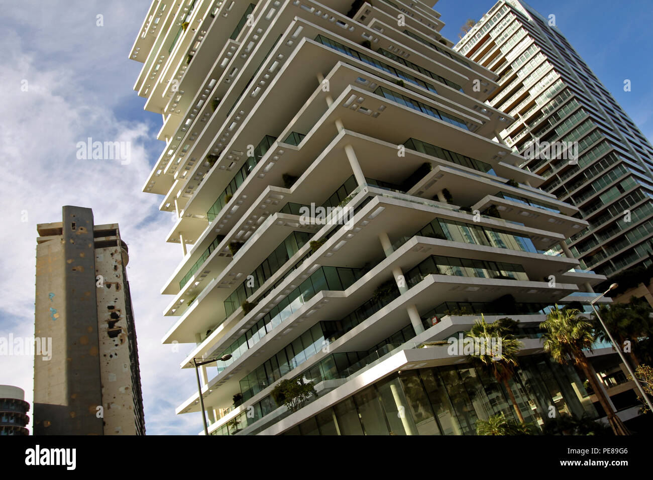 Shell-pocked Holiday Inn hotel is seen near plush buildings at what ...