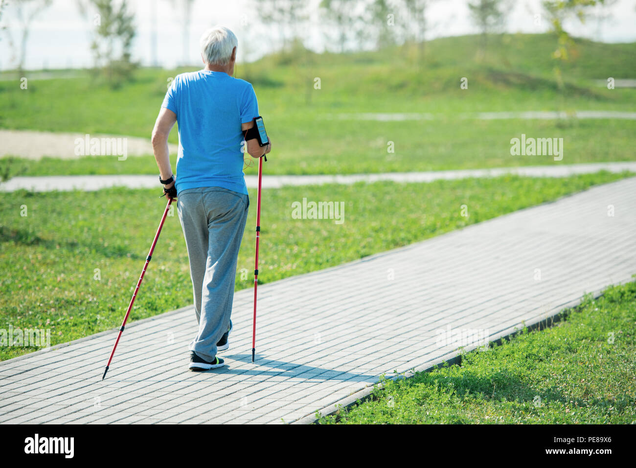 Senior Man Practicing Nordic Walking Back View Stock Photo - Alamy