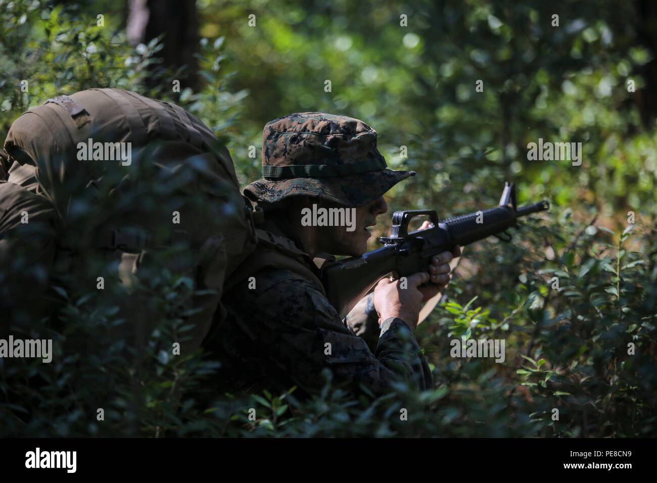A Marine candidate with 2nd Battalion, 8th Marine Regiment, assumes a ...