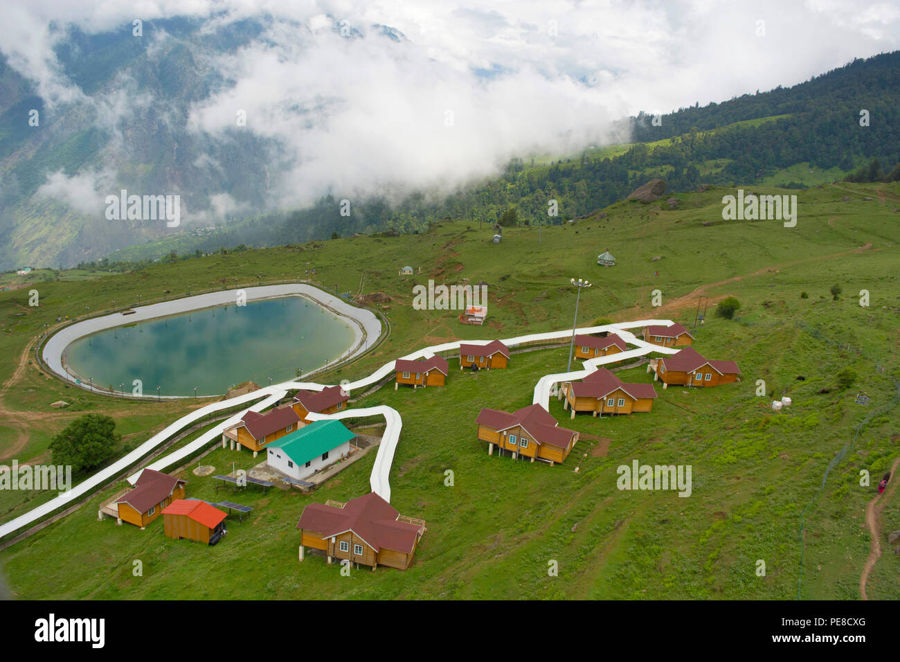 Aerial shot of Auli lake and houses, Auli, Chamoli district Uttarakhand ...