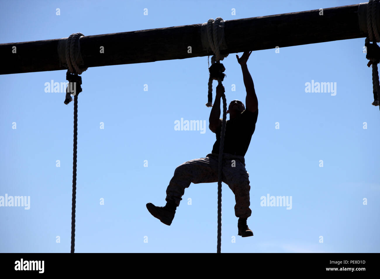 Sgt. Amado Benin II completes a rope climb during the semi-annual field ...