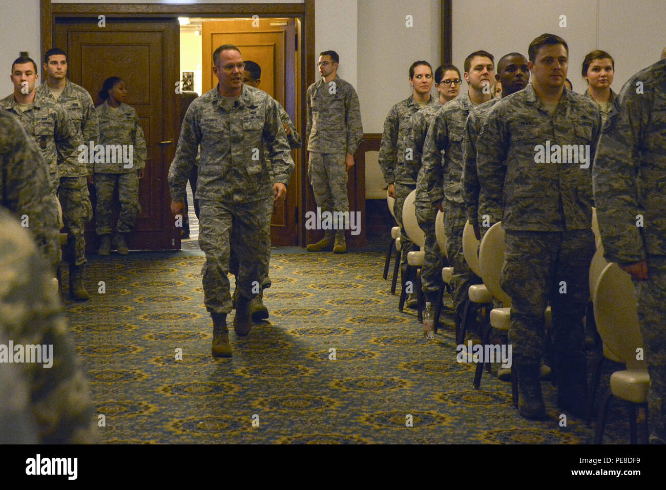 Brig. Gen. Jon T. Thomas, 86th Airlift Wing commander, enters the room ...