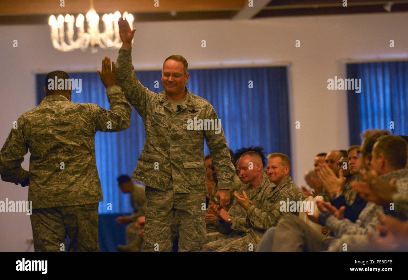 Brig. Gen. Jon T. Thomas, 86th Airlift Wing commander, high-fives Chief ...