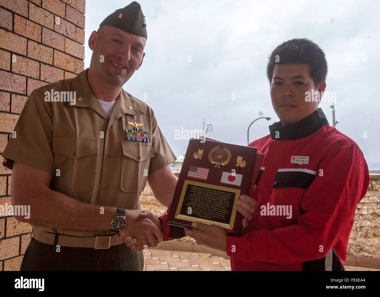 Maj. David Shearman, Left, and Ryuji Kishimoto pose for a picture ...