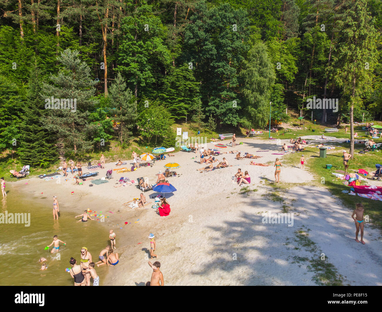 LVIV, UKRAINE - 9 JUNE, 2018: people sunbathing, swimming, resting at ...