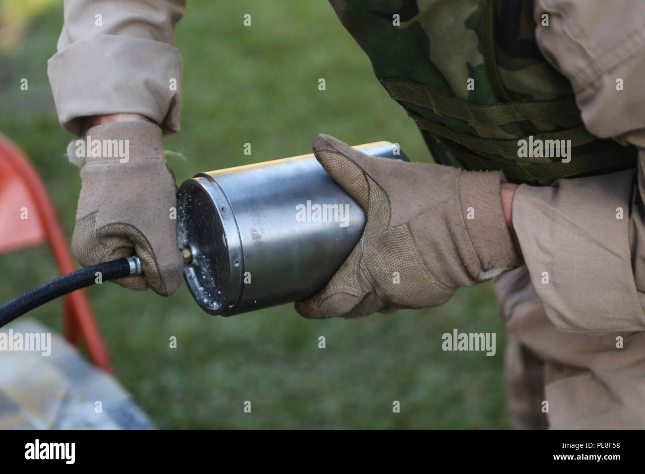 A Marine with the Explosive Ordnance Disposal Company hooks up a ...