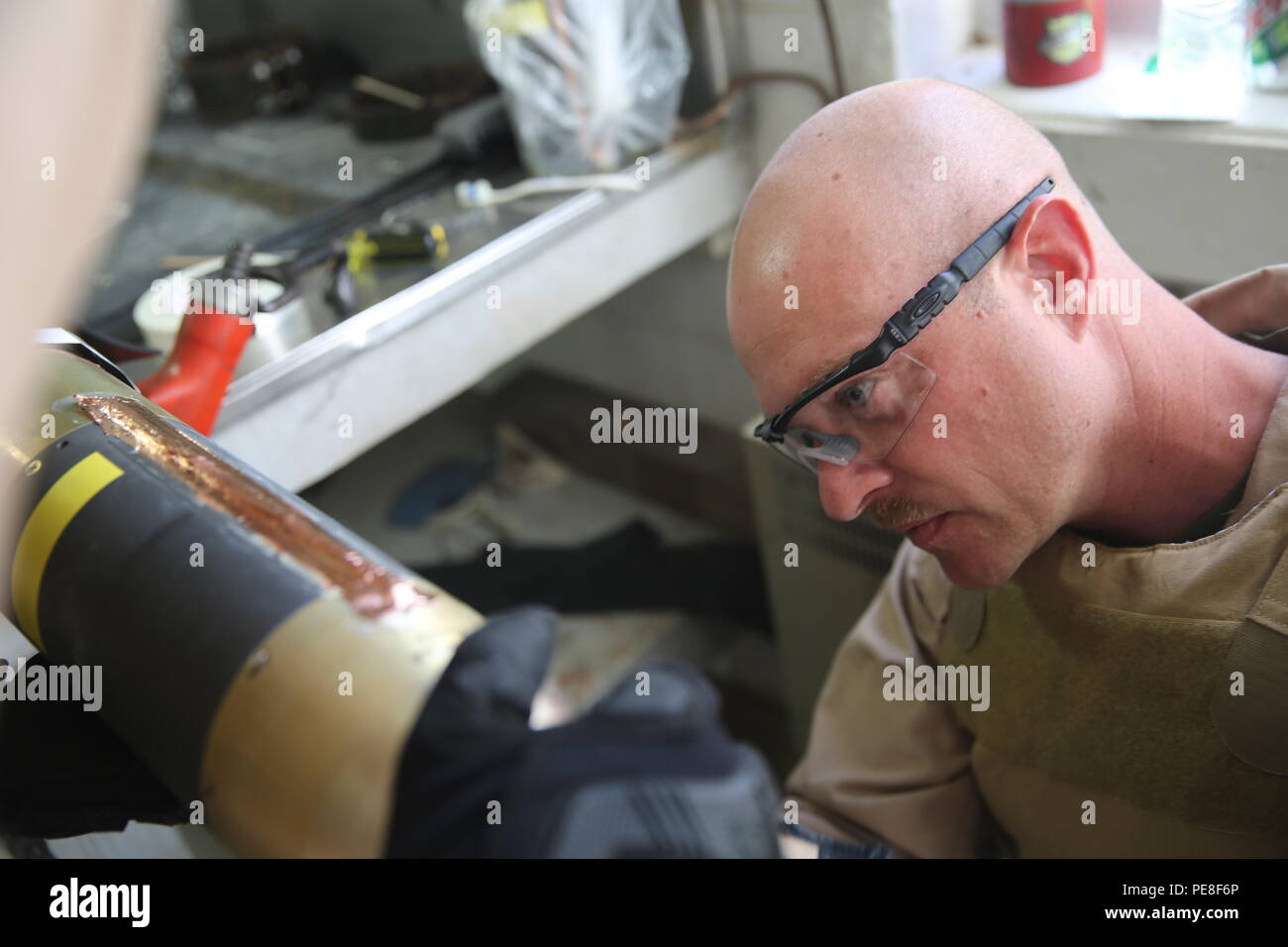 Marines with Explosive Ordnance Disposal Company attempt to disassemble ...