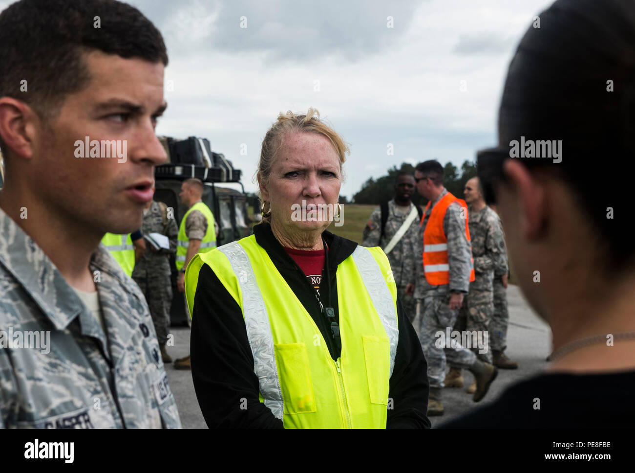 Tech. Sgt. Tyler Casper speaks to a local in a scenario as Peg ...