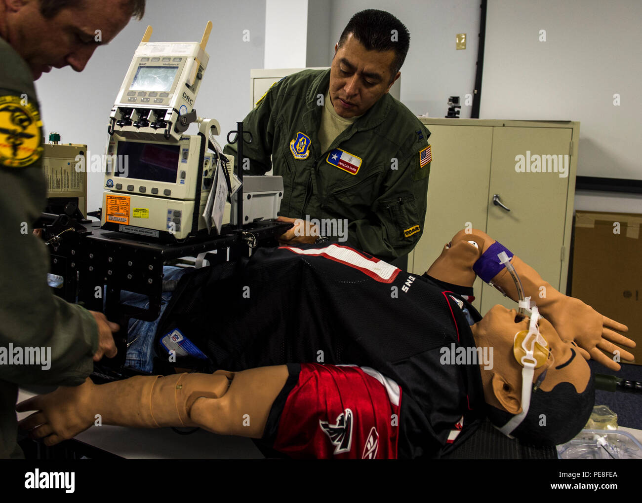 A U.S. Air Force Critical Care Air Transport Team practices securing a ...