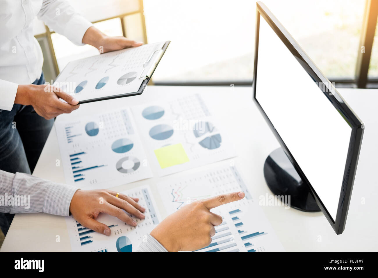 businessman working together pointing screen while discussing explaining a business analysis ...