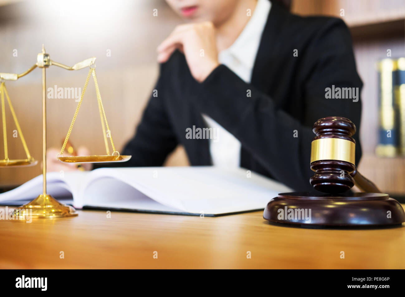 lawyer judge reading documents at desk in courtroom working on wooden ...