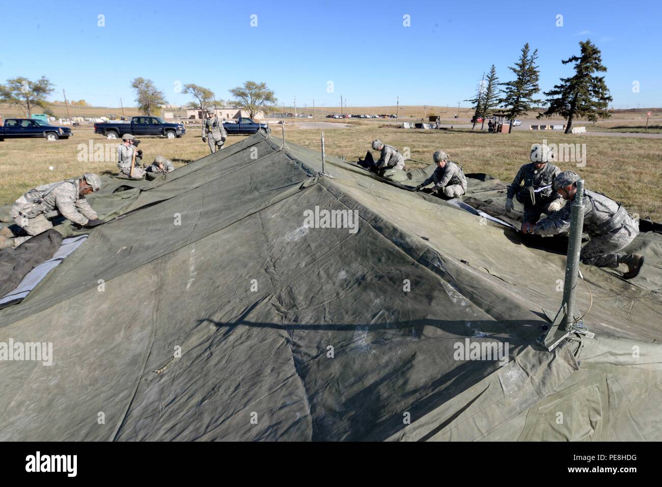 Airmen from the 28th Civil Engineer Squadron build a temper tent during ...