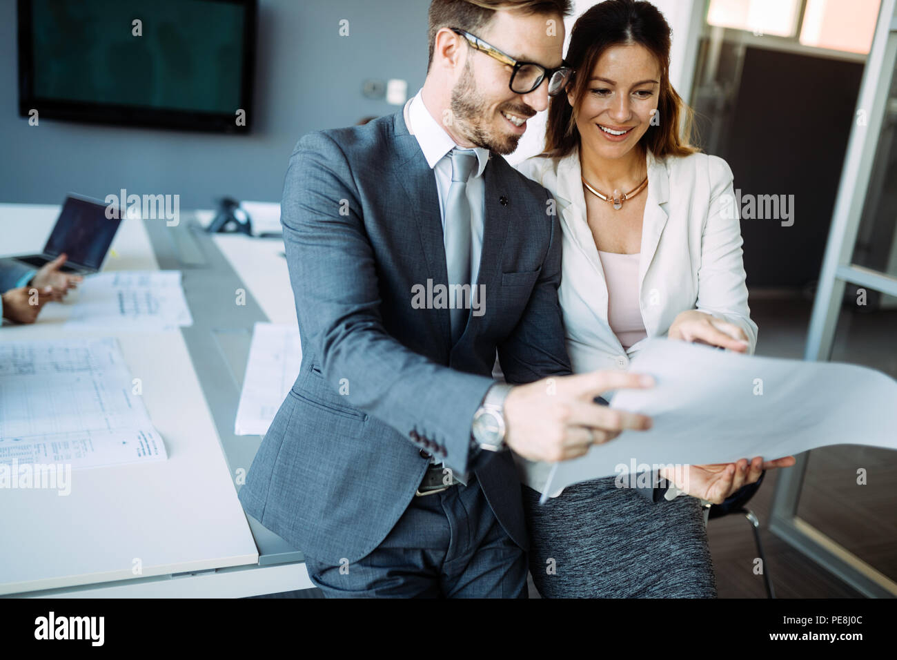 Young designers talking on break about business plans Stock Photo - Alamy