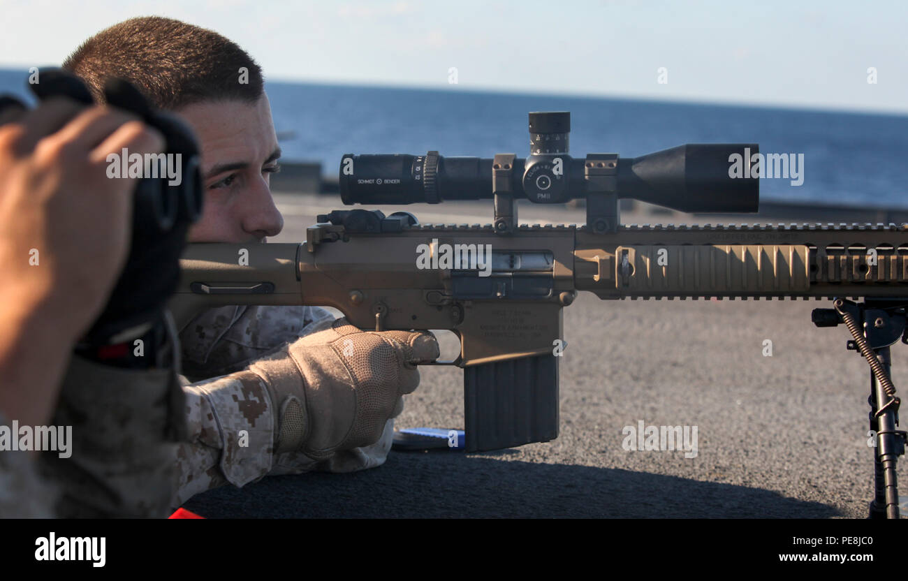 A Marine designated marksman observes and engages targets using the ...