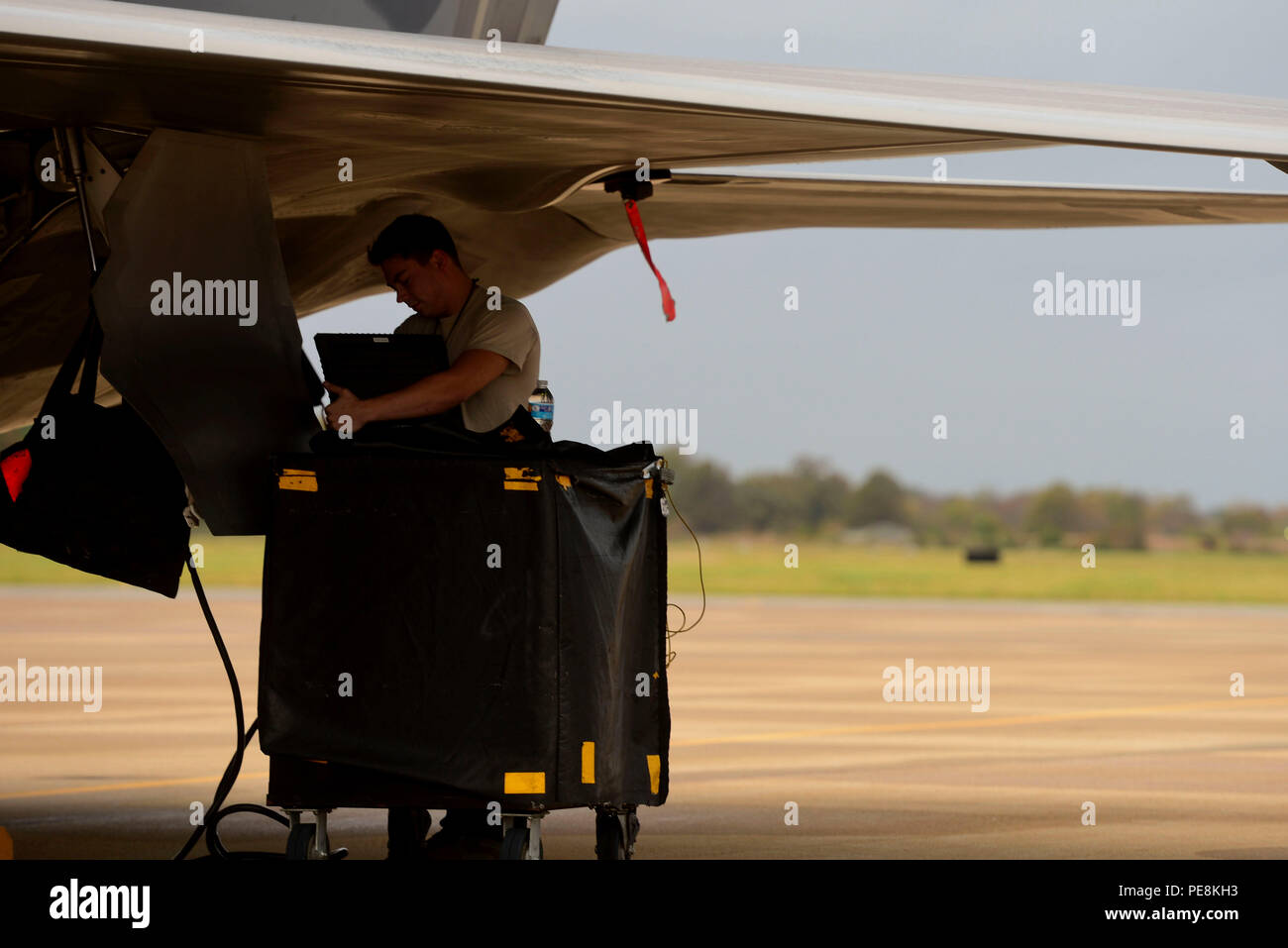 A U.S. Air Force Airman assigned to the 1st Maintenance Group plugs a ...