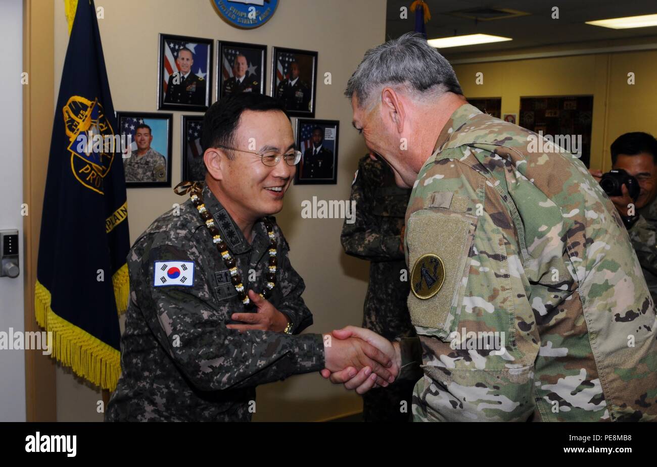 Chaplain (Col.) Michael Dugal (right) greets the Republic of Korea Army Chief of Chaplains ...